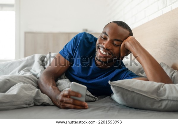 Happy Black Guy Using Mobile Phone Stock Photo 2201553993 | Shutterstock