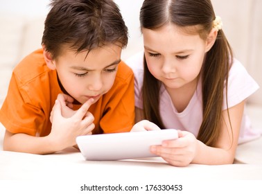 Children Using Tablet While Sitting Table Stock Photo (Edit Now) 166952768