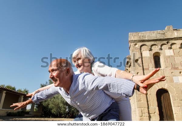 Happy Elderly Couple Playing Simulating Airplane Stock Photo 1869047722 ...