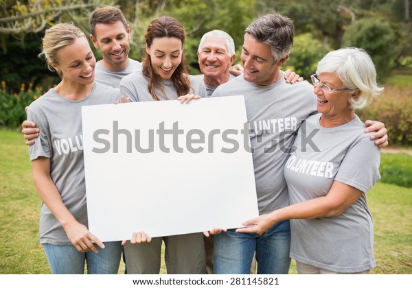 Happy Volunteer Family Holding Blank On Stock Photo (Edit Now) 281145821 Happy Volunteer Family Holding Blank On Stock Photo (Edit Now) 281145821