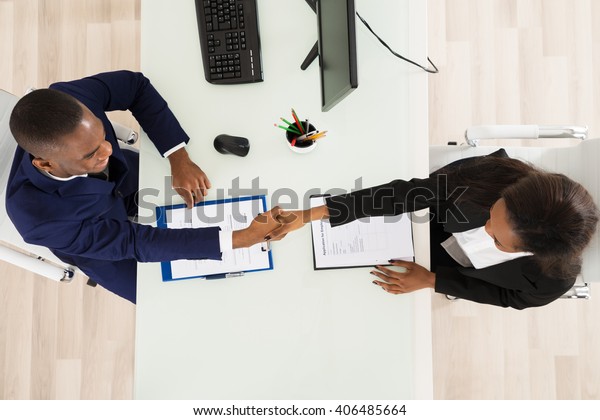 High Angle View Two Businesspeople Shaking Stock Photo (Edit Now) 406485664 High Angle View Two Businesspeople Shaking Stock Photo (Edit Now) 406485664