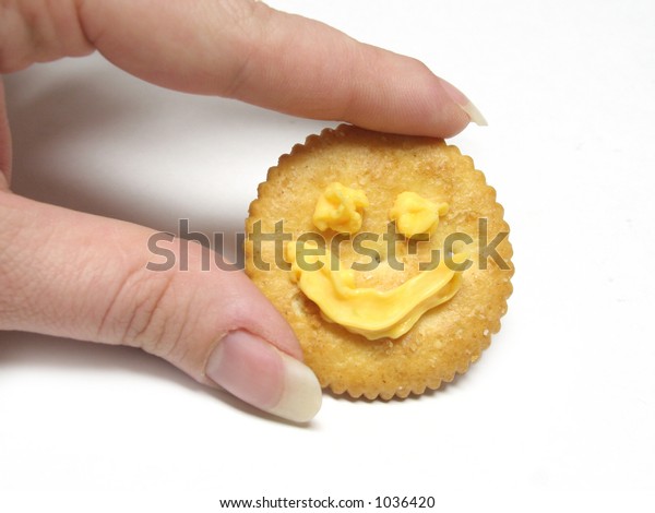 Holding Snack Cracker Smiley Face Isolated Stock Photo 1036420 ...