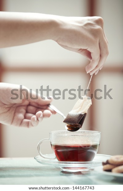 Human Hands Making Tea Stock Photo (Edit Now) 144167743