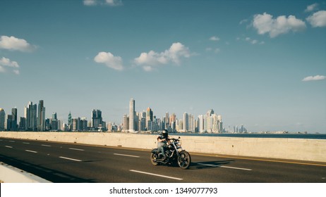 Motorcyclist watching the city and northern lights view 2K wallpaper ...