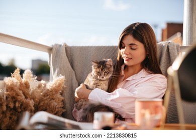 A girl With Her Cat And Drinking Tea 4K wallpaper download