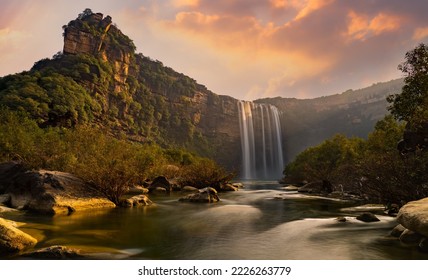 The view of the waterfall flowing above the hills in daylight 2K ...