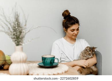 A girl With Her Cat And Drinking Tea 4K wallpaper download