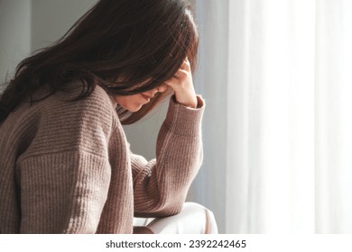 Sad girl sitting on rock 2K wallpaper download