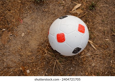 Black and white soccer ball on sand ground 2K wallpaper download