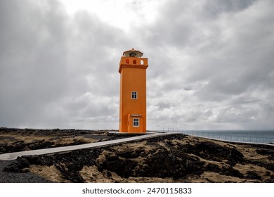 Nautical View of Snow-Covered Peak and Lighthouse through Porthole ...