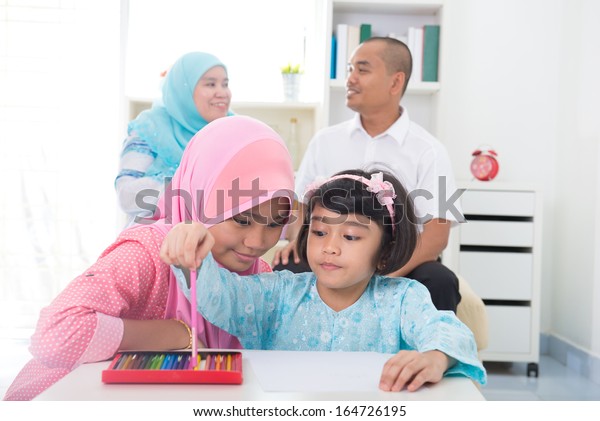 Indonesian Muslim Family Learning Together Lifestyle Stock Photo ... Indonesian Muslim Family Learning Together Lifestyle Stock Photo ...
