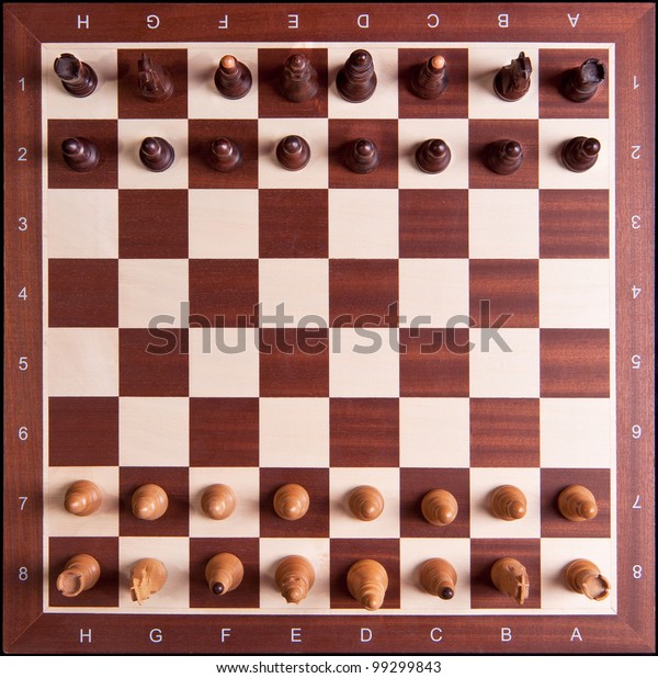 The initial setup of a chess board. The pieces and chess board are made ...