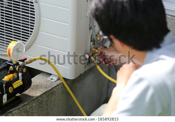 Installing Air Conditioner Stock Photo (Edit Now) 185892815