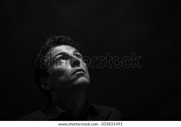 Стоковая фотография 503831491: Isolated Thinking Man Face Looking Low ...