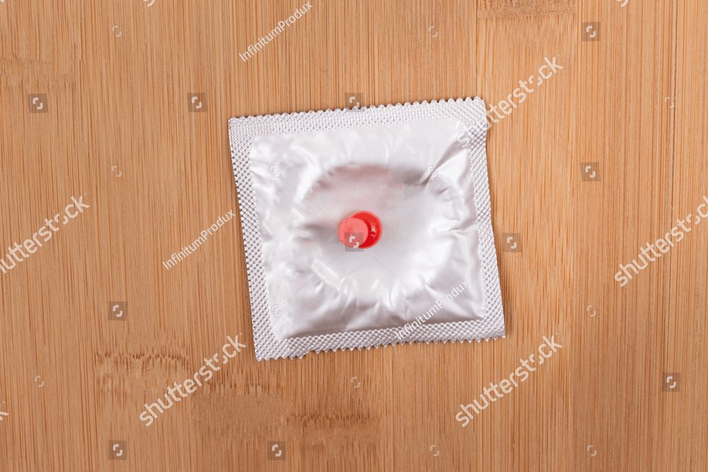 A Joke On Colleagues Freebie Or A Defective Condom Packaged Latex Condom Pinned To A Wooden