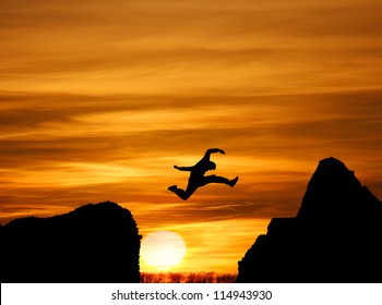 Man Jump Through Gap Between Hill Stock Photo 394537900 | Shutterstock