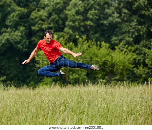 Kickbox Fighter Executing Lateral Jumping Kick Stock Photo 662331001 ...