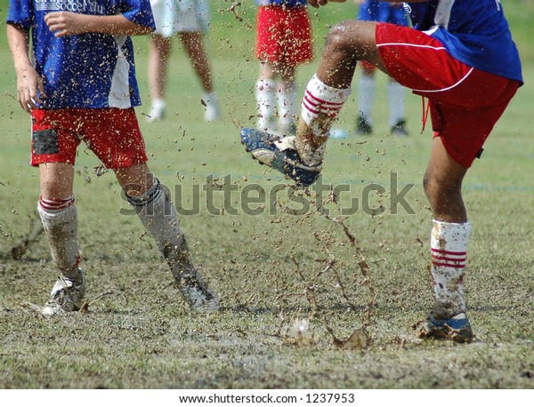 Kicking Mud Soccer Stock Photo (Edit Now) 1237953