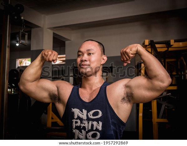 Large Burly Man Executes Double Bicep Stock Photo 1957292869 | Shutterstock