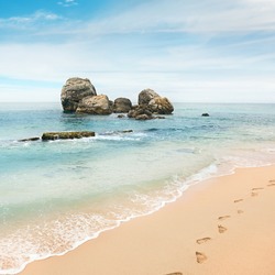 Large rock in the ocean featuring bay, beach, and beautiful, a Nature ...