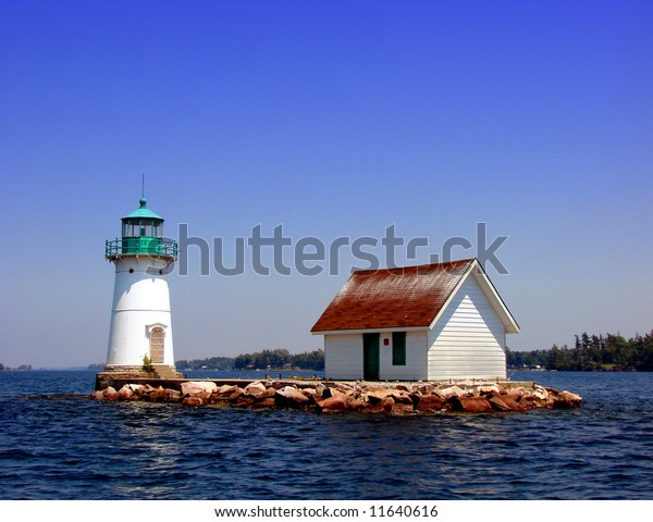Lighthouse Cabin Atop Tiny Rock Island Stock Photo 11640616 | Shutterstock