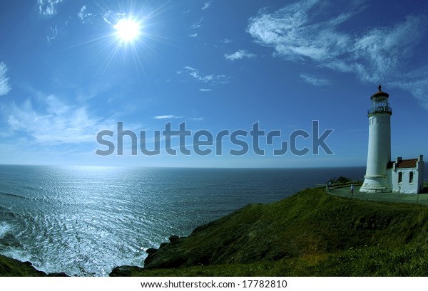 Lighthouse On Hillside Overlooking Ocean Stock Photo (Edit Now) 17782810
