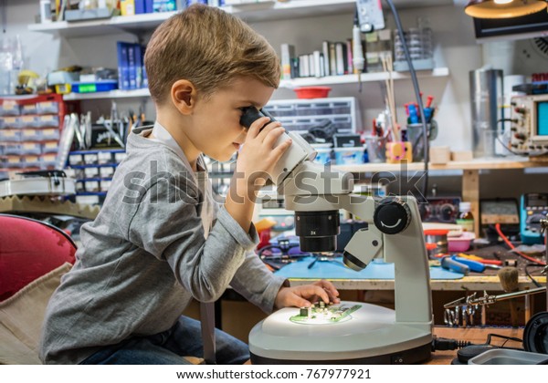 Little Boy Looking Through Microscope While Stock Photo (Edit Now ...