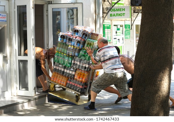 Loader Men Pushing Cart Fully Laden Stock Photo (Edit Now) 1742467433
