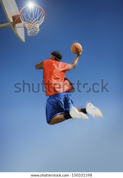 Low Angle View Man Dunking Basketball Stock Photo 150331598 | Shutterstock