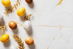 Luxury Easter eggs and golden branches on marble table. Happy Easter ...