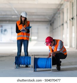 Maintenance Engineers Checking Cables On Construction Stock Photo ...