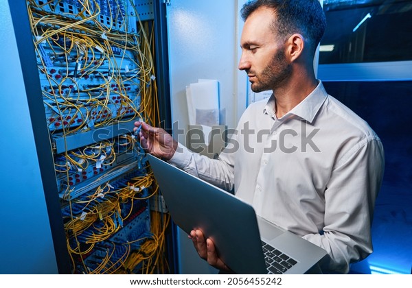 Male Engineer Connecting Cable Server Rack Stock Photo 2056455242 ...