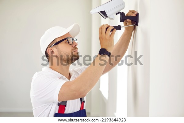 Male Worker Installing Security Camera Inside Stock Photo 2193644923 ...