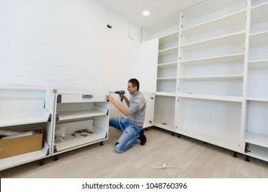 Man Assembling Kitchen Cupboard Using Screwdriver Stock Photo ...
