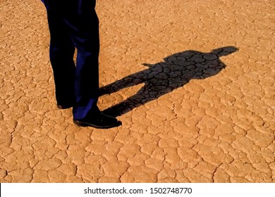Стоковая фотография 1502748770: Man Casting Full Body Shadow On ...