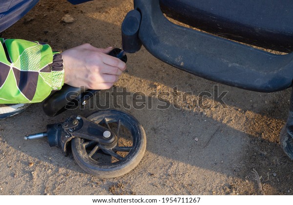 Man Changes Old Broken Wheel Baby Stock Photo 1954711267 | Shutterstock
