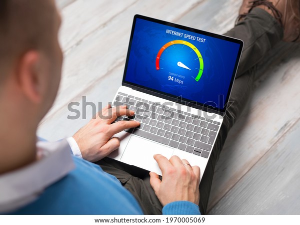 Man Checking Internet Connection Speed On Stock Photo (Edit Now) 1970005069 Man Checking Internet Connection Speed On Stock Photo (Edit Now) 1970005069