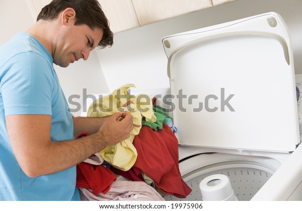 Man Doing Laundry Stock Photo (Edit Now) 19975906