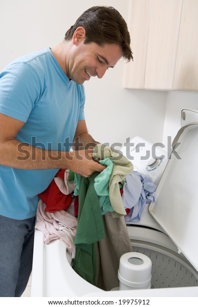 Man Doing Laundry Stock Photo (Edit Now) 19975912
