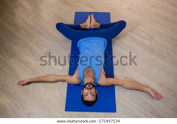 Man Doing Reclining Bound Angle Pose Stock Photo 575497534 | Shutterstock