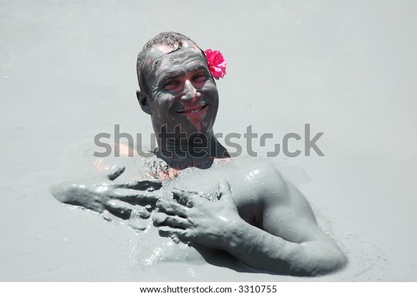 Man Getting Mudbaths Stock Photo (Edit Now) 3310755