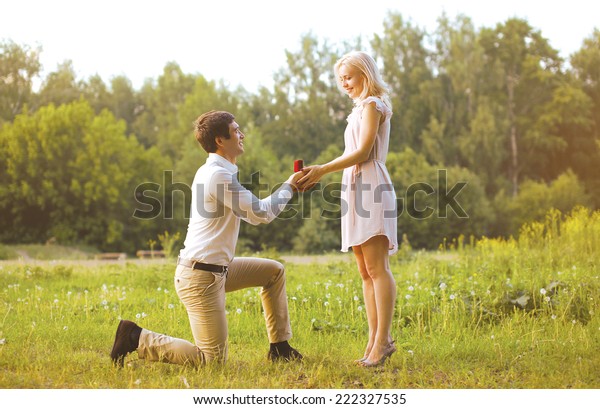 Man Giving A Ring Woman Love Couple Date Wedding Concept