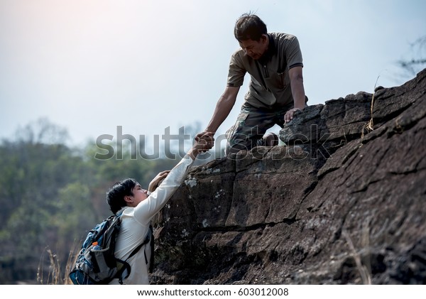 Man Helping Pulling Young Man High Stock Photo 603012008 | Shutterstock