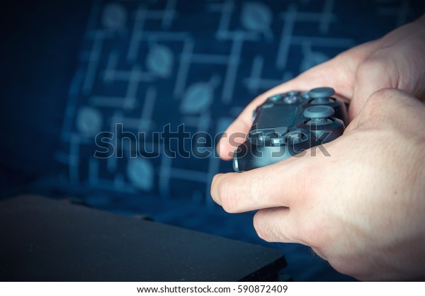 Man Holding Game Controller Sitting On Stock Photo (Edit Now) 590872409