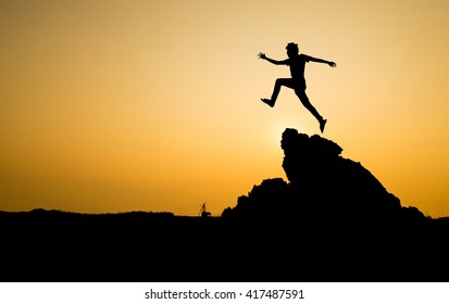 Man Jump Through Gap Between Hill Stock Photo 417487591 | Shutterstock
