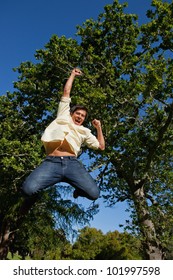 Man Jumping Off Ground While Raising Stock Photo 101997598 | Shutterstock