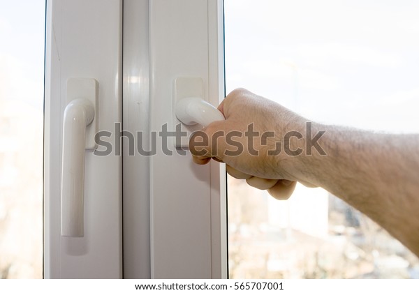 Man Opening Window Stock Photo 565707001 | Shutterstock