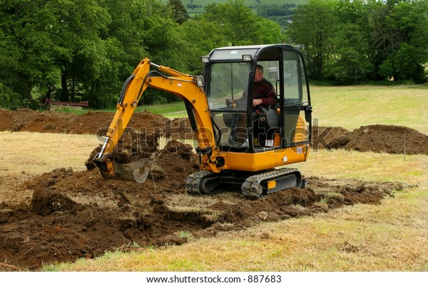 Man Operating Mini Digger Field Stock Photo 887683 | Shutterstock