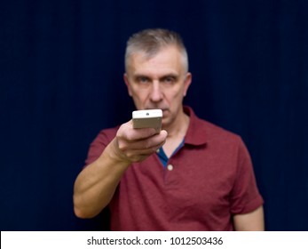 Man Pointing Remote Control Front Studio Stock Photo 1012503436 ...