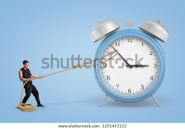 Man Pulling Clock Hands Rope On Stock Photo (Edit Now) 1255457215